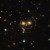 NASA’s Hubble Space Telescope Captures Smiling Galaxy Cluster ...