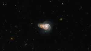 Two Spiral Galaxies Appear to Overlap in New Hubble Image | Sci.News